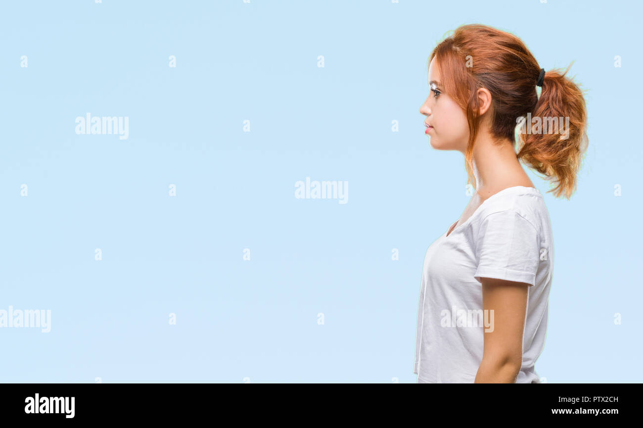 Young beautiful woman over isolated background looking to side, relax ...
