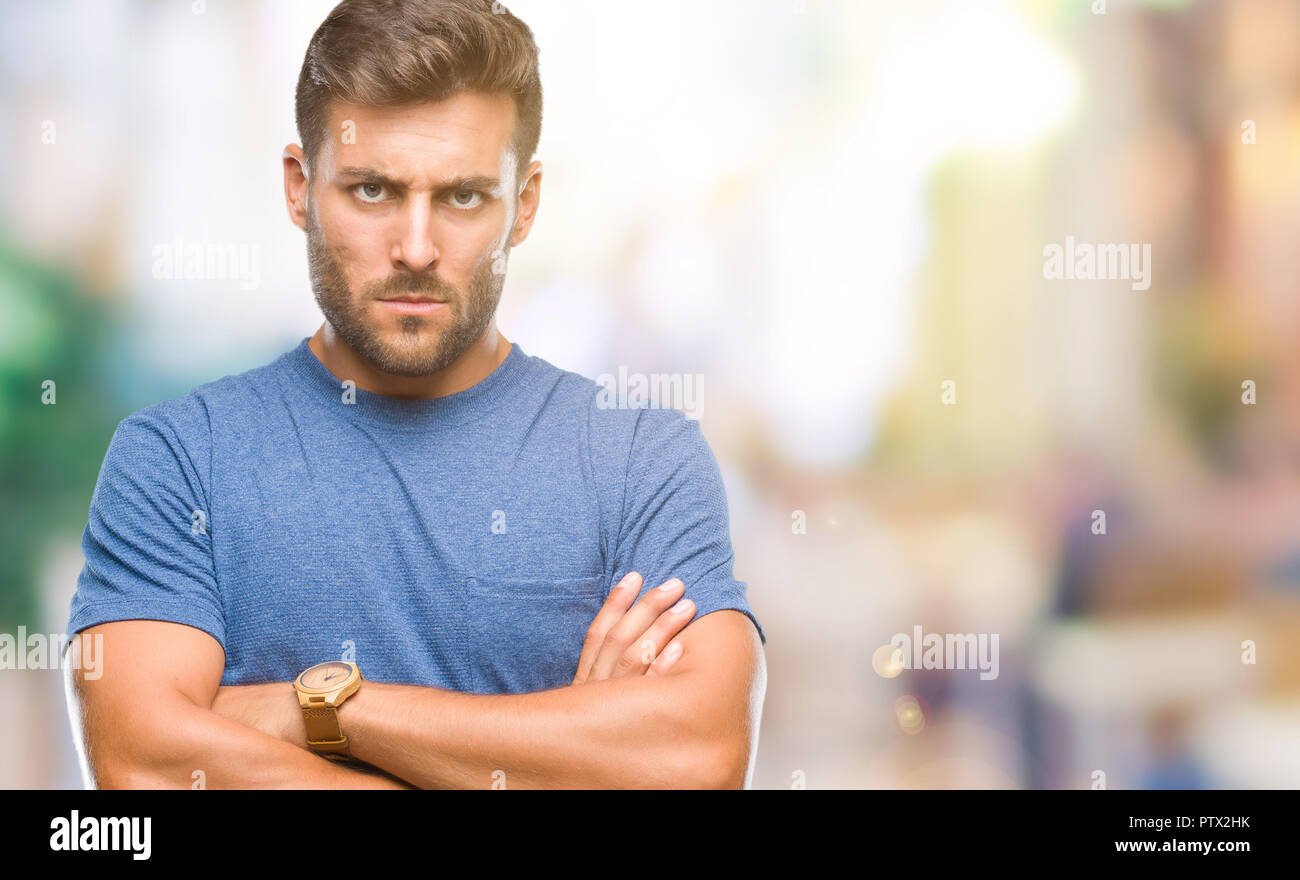 Young handsome man over isolated background skeptic and nervous ...