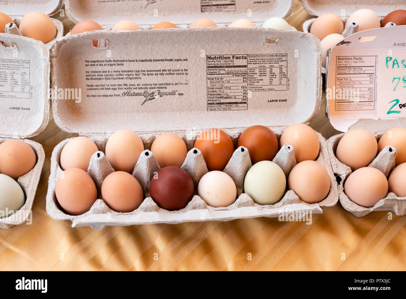 Fresh pasture raised eggs on display at the farmers market Stock Photo ...