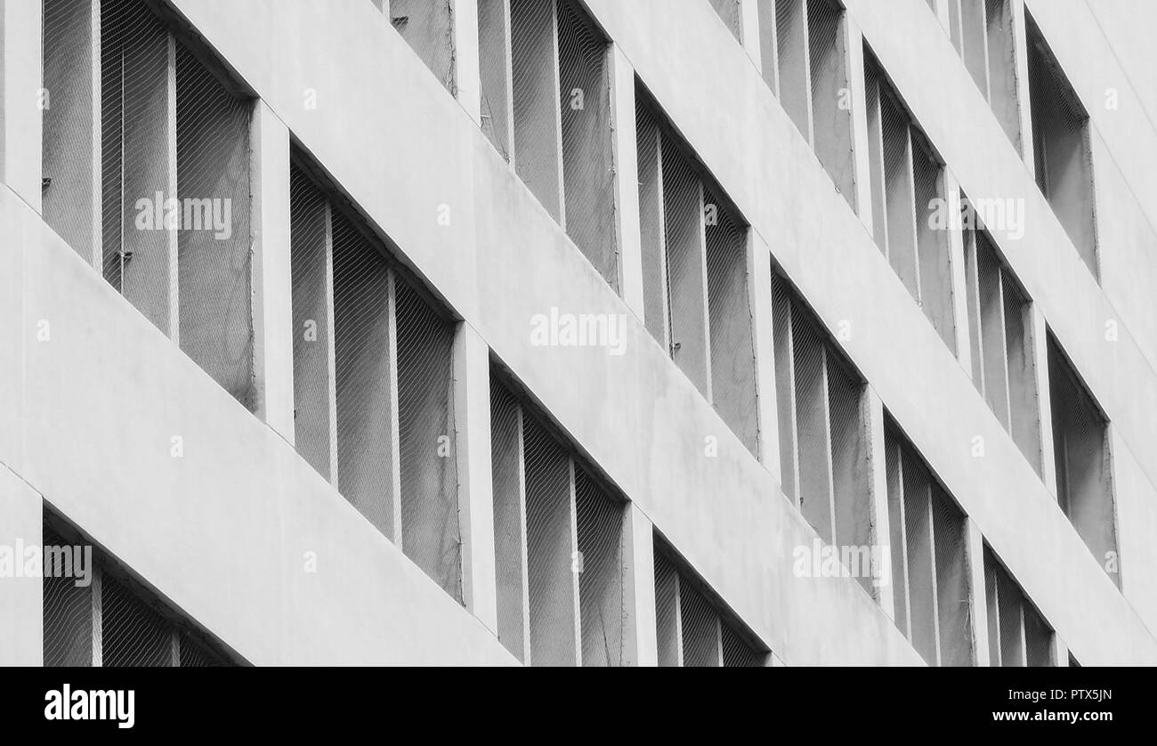 Closeup ventilated facade of concrete building. White ventilation with ...