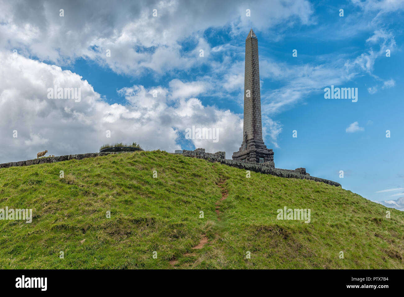 Obelisk on top of one tree hill in auckland against a blue sky with ...