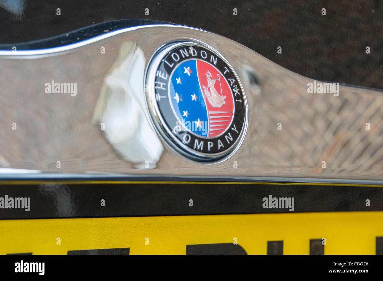 Closeup of a London Taxi Company logo and badge Stock Photo - Alamy