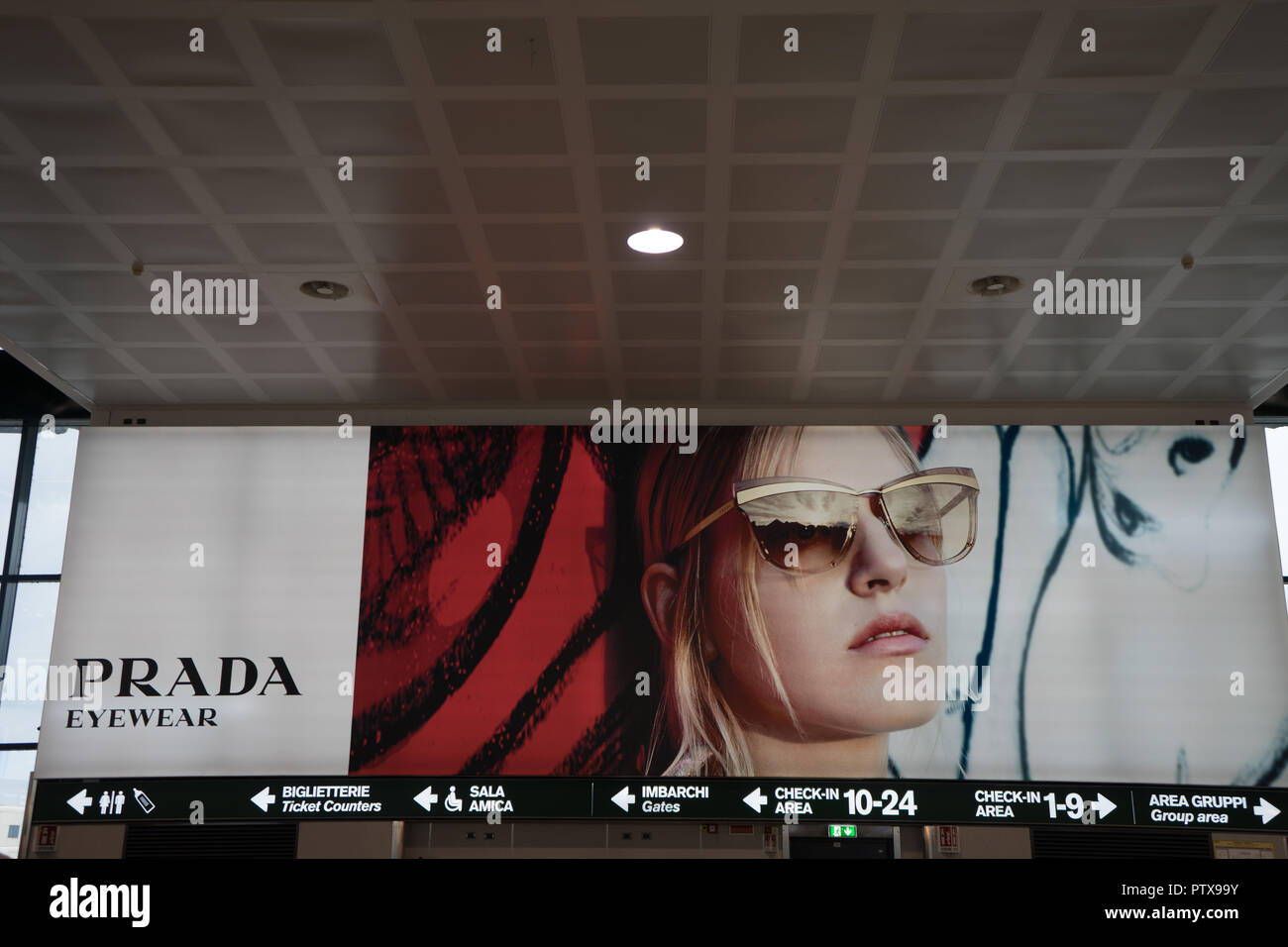 Milan Airport, Italy-April 2, 2018: Prada advertisement at The milan ...