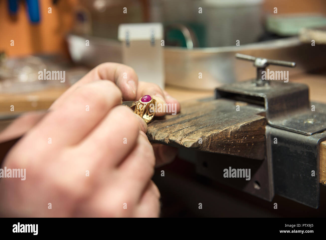 jeweler makes a piece of jewelry in the workplace Stock Photo - Alamy
