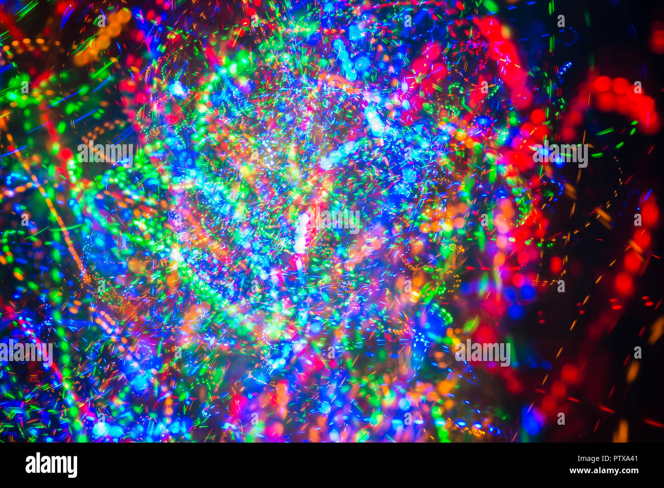 abstract background of colored lights on a dark background Stock Photo ...