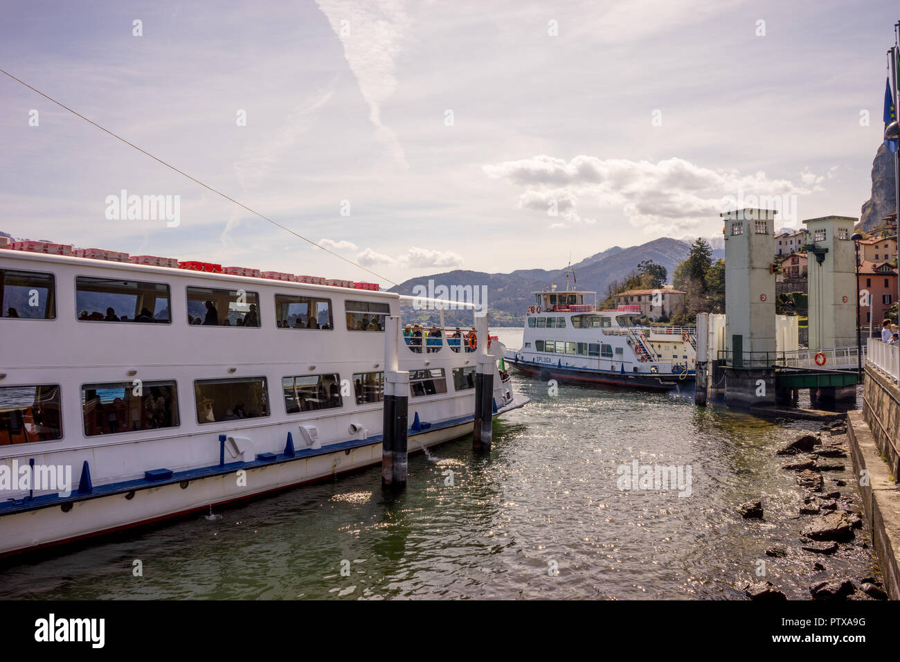 Menaggio, Italy-April 2, 2018: traffic jam with ferry boat on the lake ...