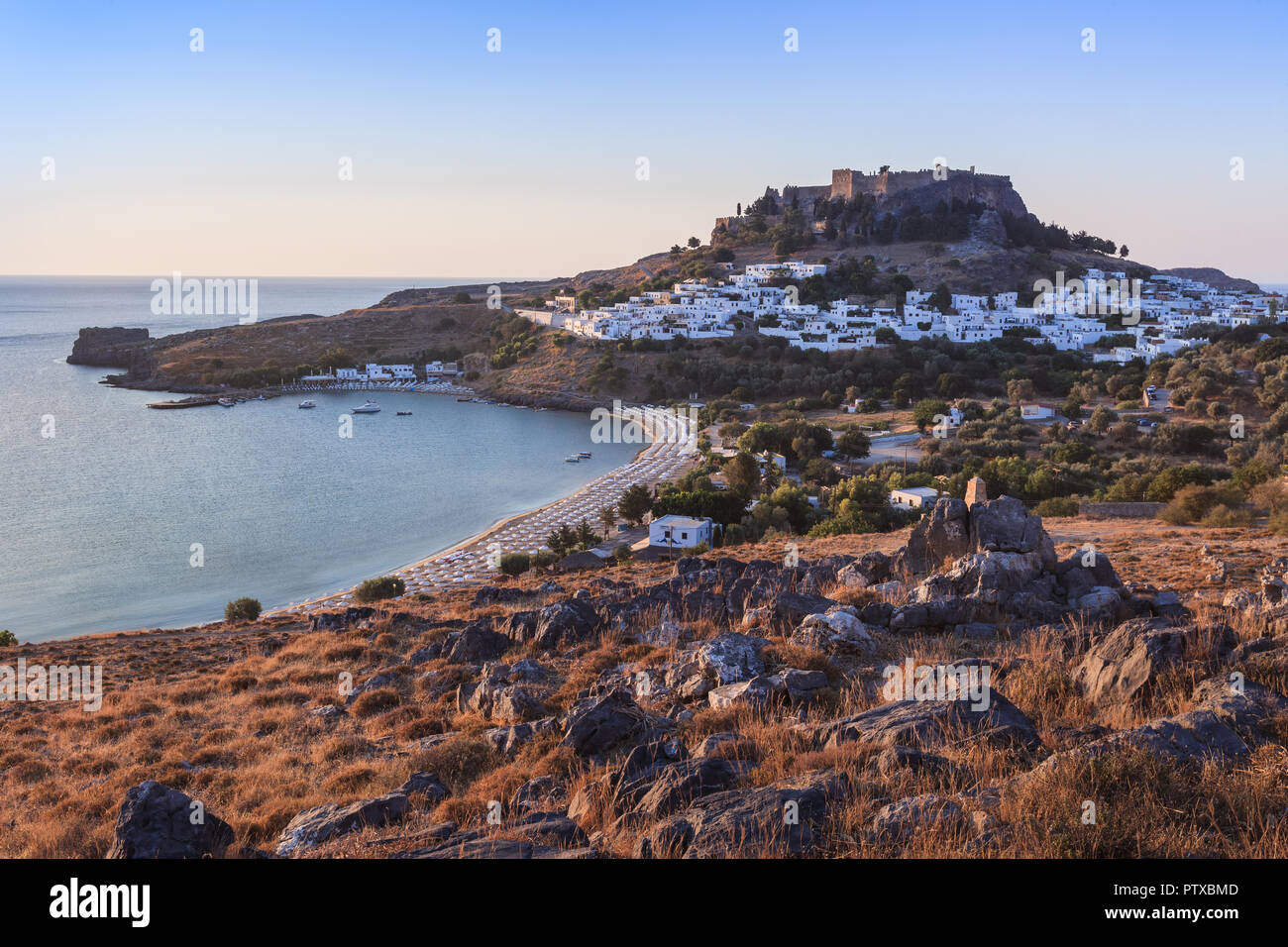 Lindos with the castle above on the Greek Island of Rhodes Stock Photo ...