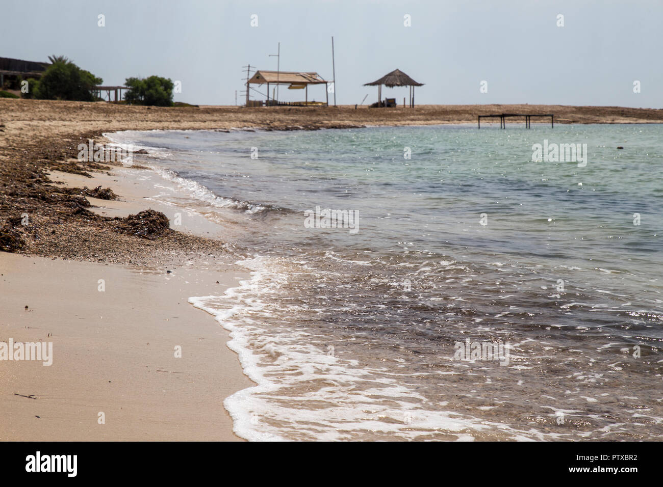 Soft blue ocean wave on sandy beach. Bottom. White sand on the beach ...