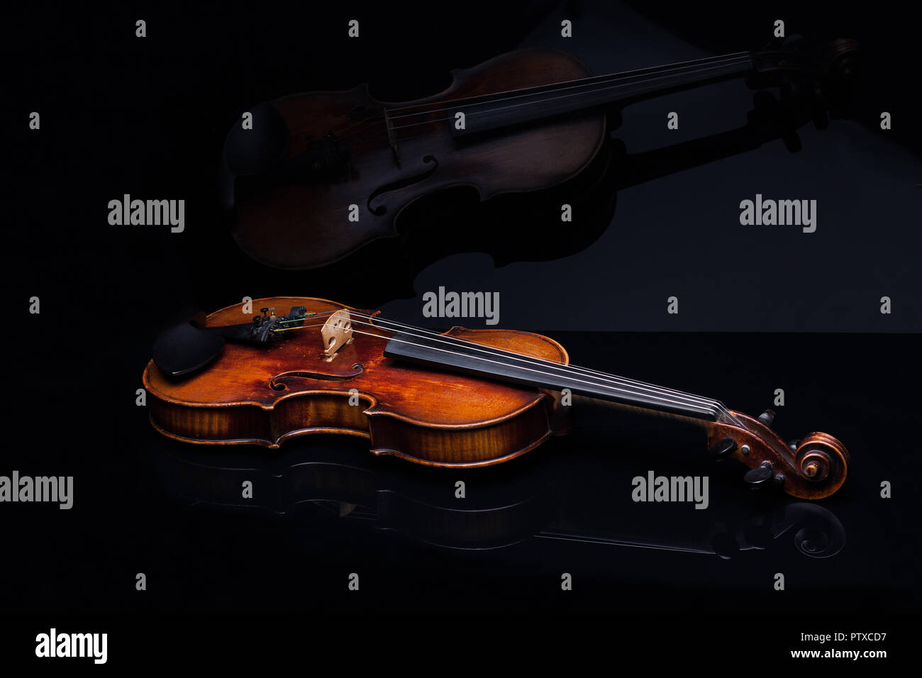 Violin front view, on a black background. String instrument Stock Photo ...