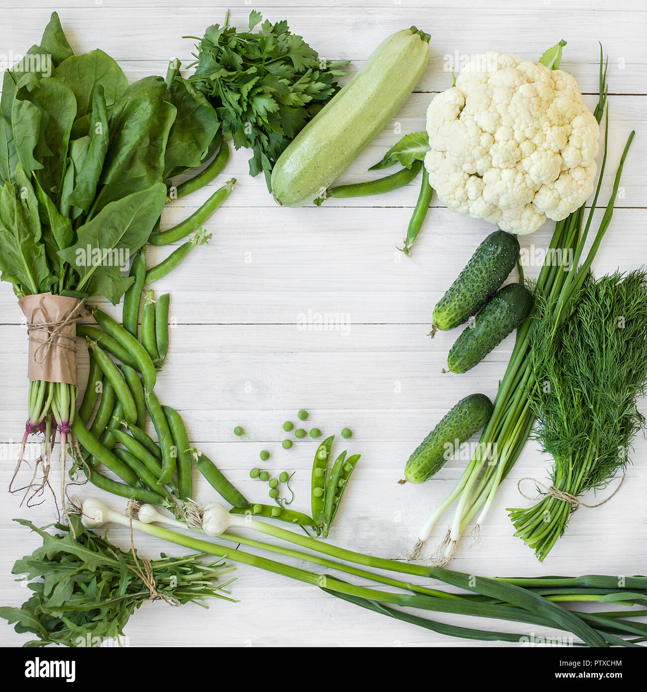 Composition on a white background of green organic vegetarian products ...