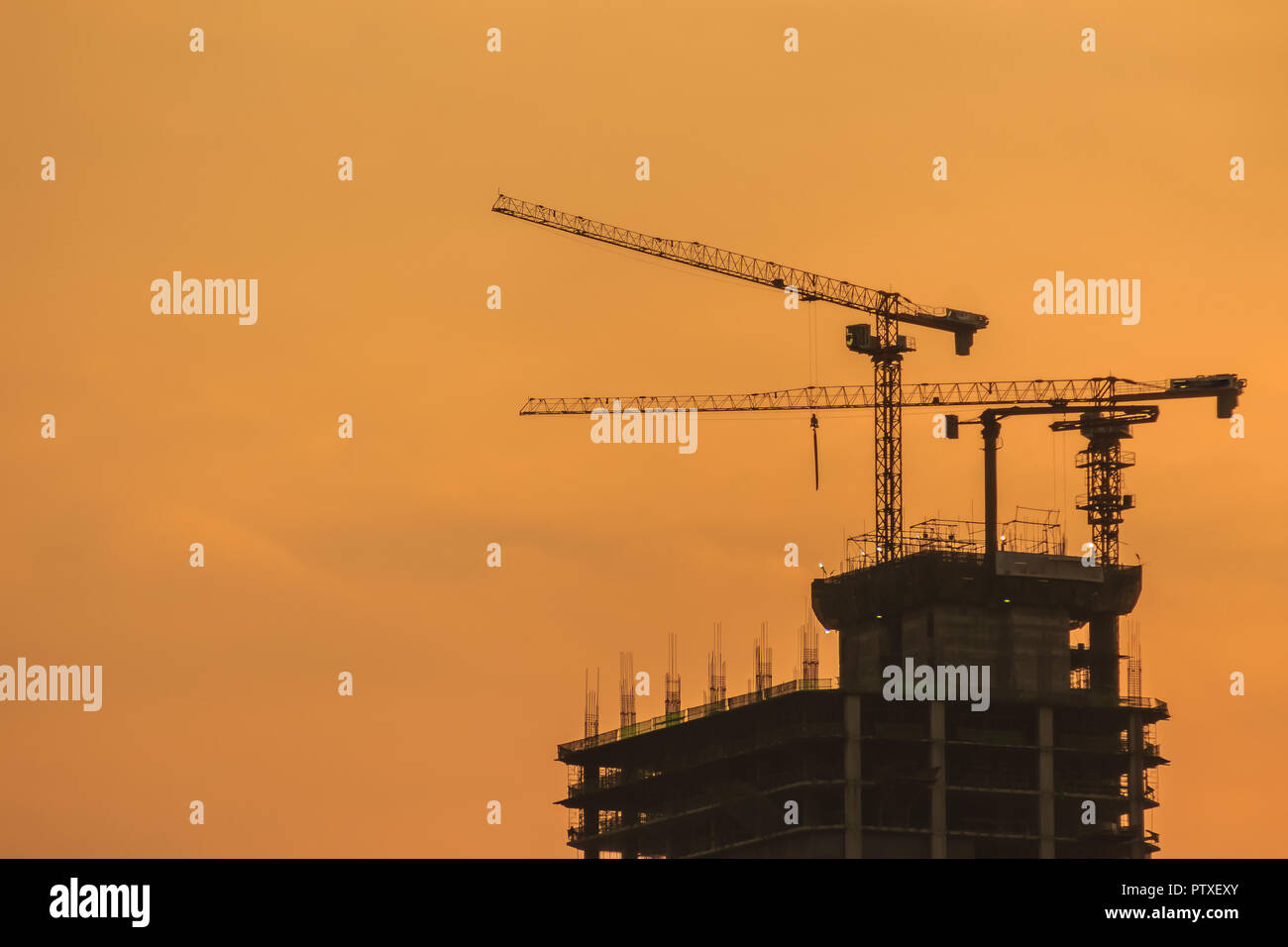 High-rise condominium building under construction in blue and yellow ...
