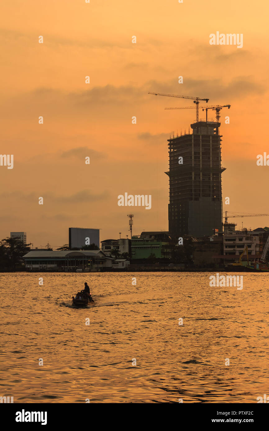 High-rise condominium building under construction in blue and yellow ...