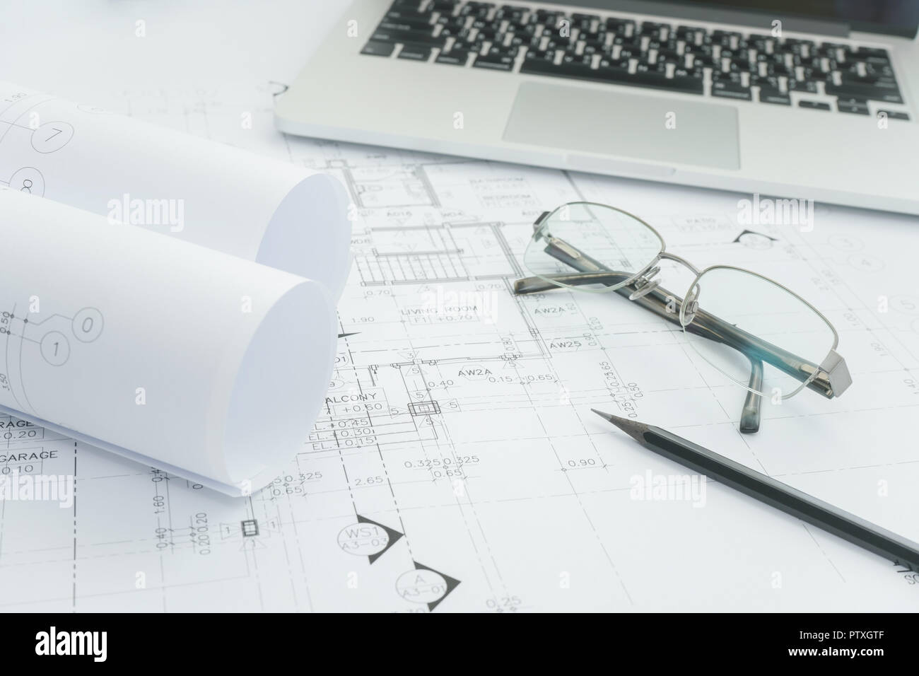 black pencil and computer laptop on architectural drawing paper for ...