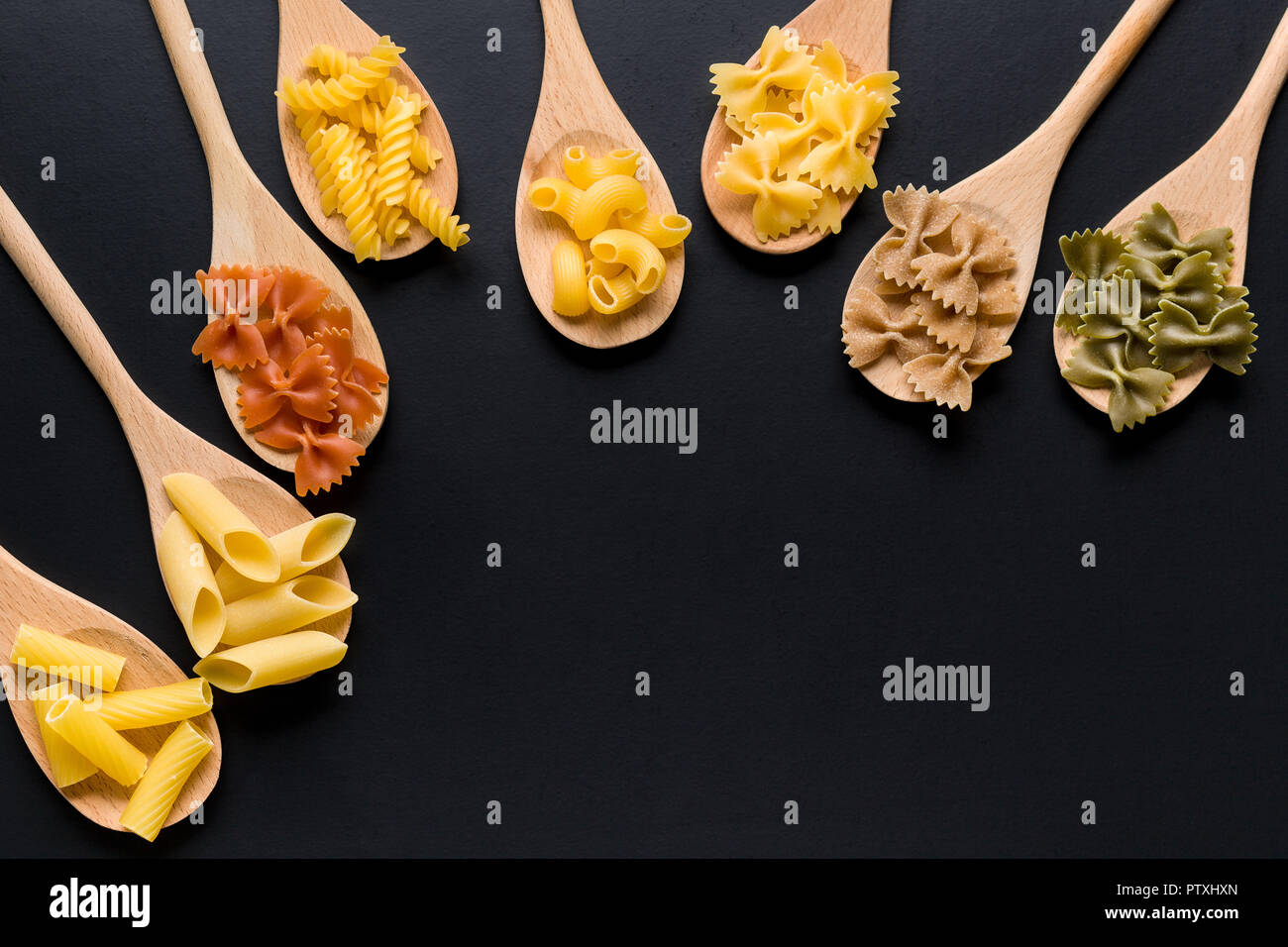 Macaroni in wooden spoon hi-res stock photography and images - Alamy