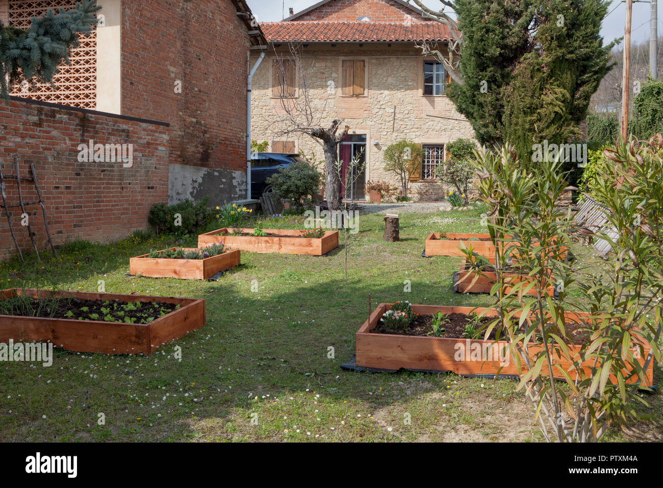 vegetable garden tubs in a garden of a country house Stock Photo - Alamy