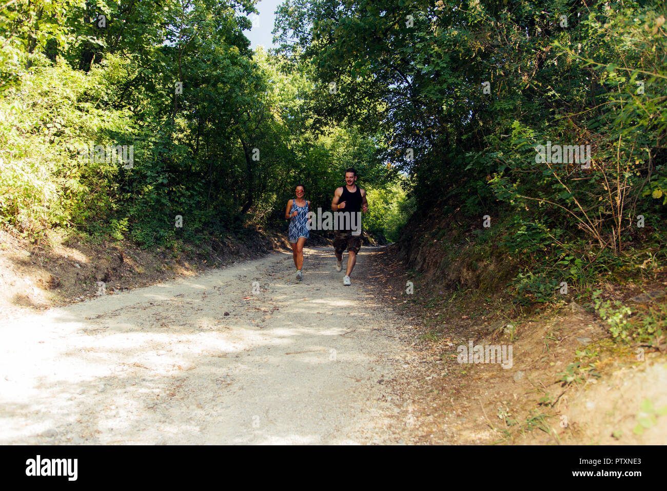 Couple attractive marathon runners jogging hi-res stock photography and ...