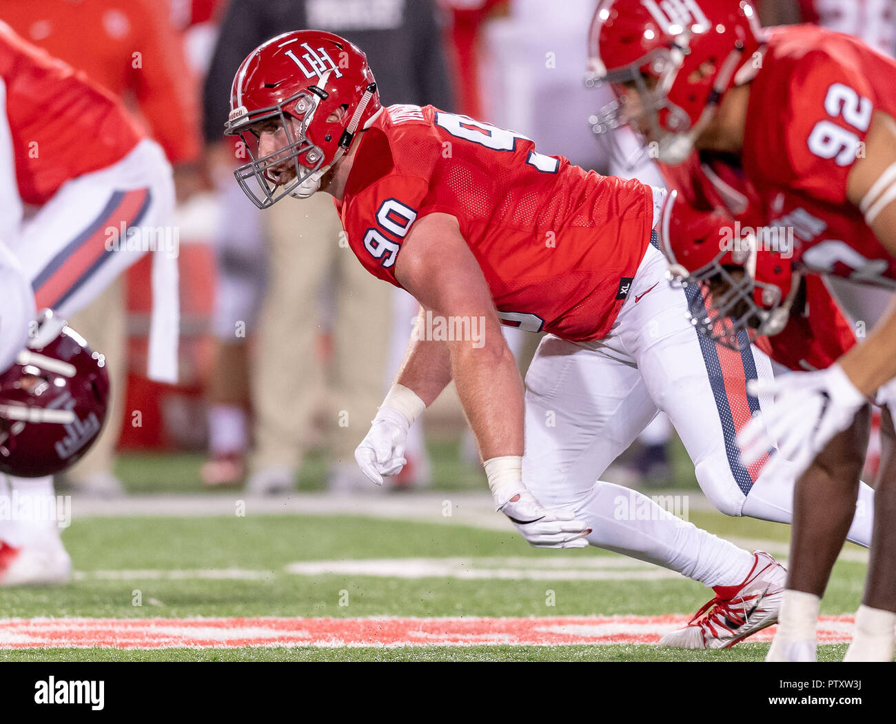 Houston Cougars defensive end Zach Vaughan (90) comes off the line ...