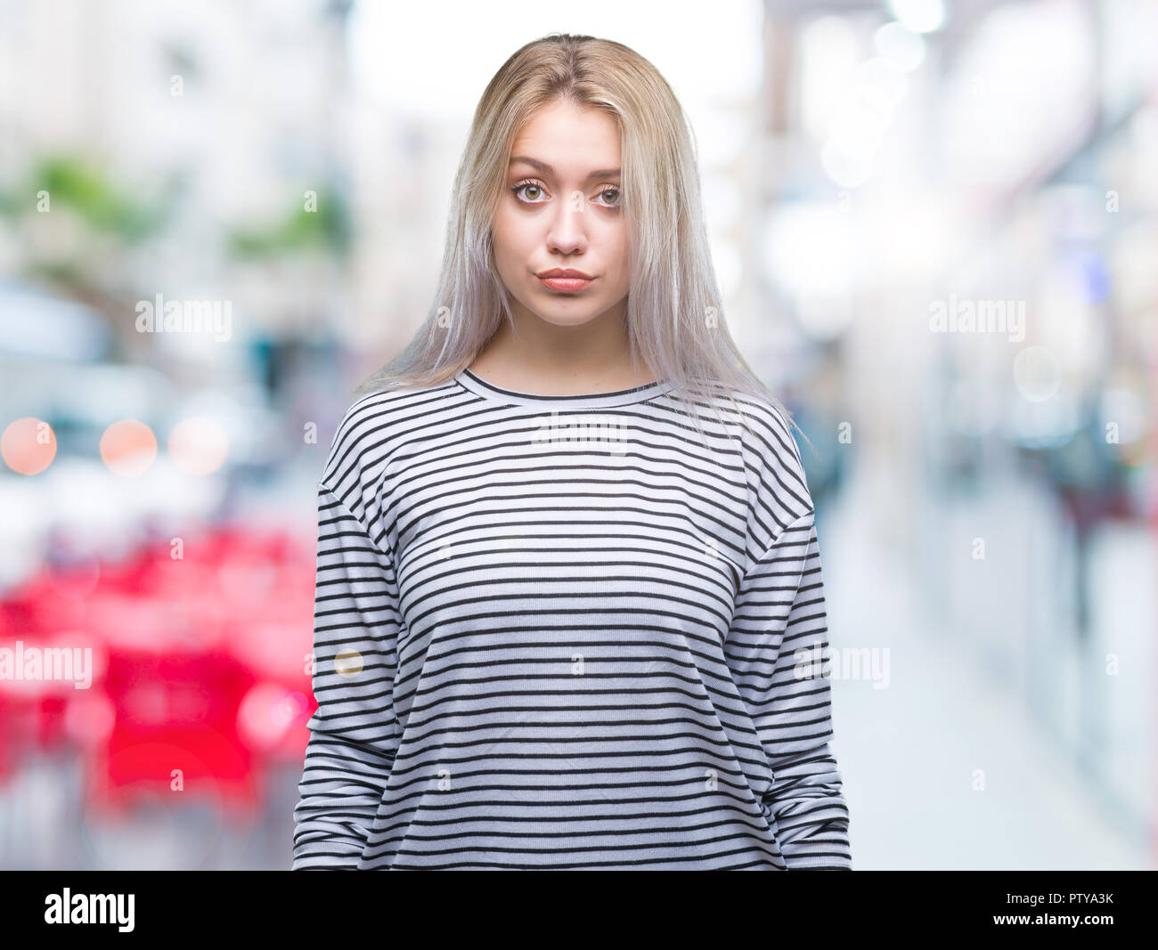 Young blonde woman over isolated background depressed and worry for ...