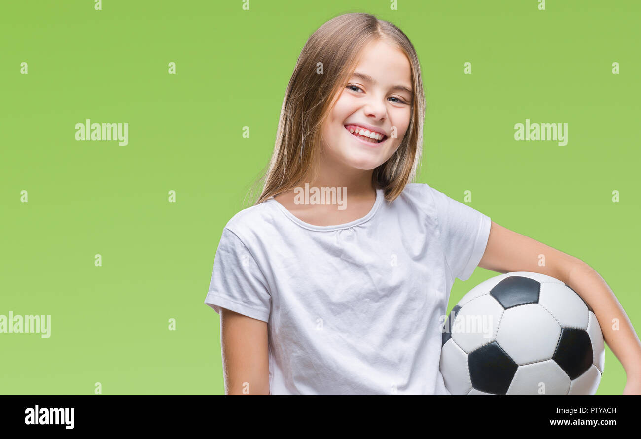 Young beautiful girl holding soccer football ball over isolated ...
