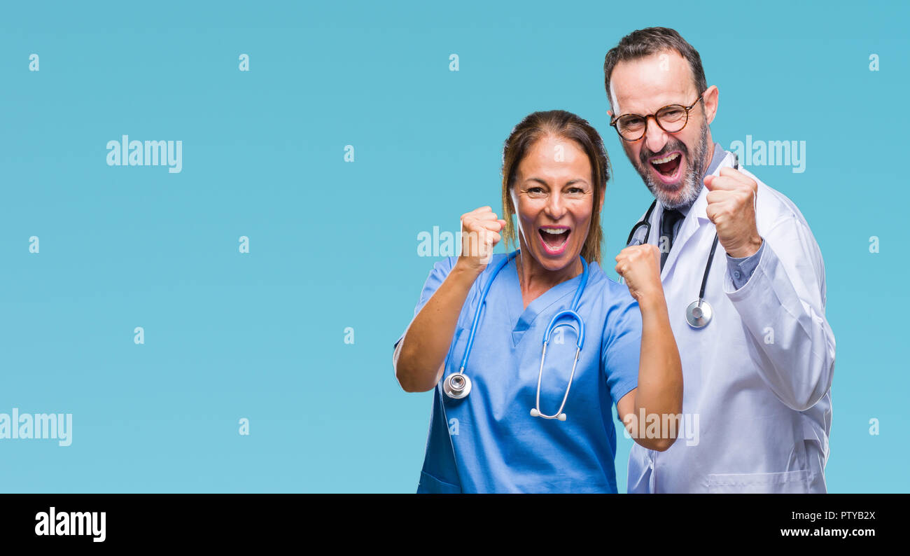 Middle age hispanic doctors partners couple wearing medical uniform ...