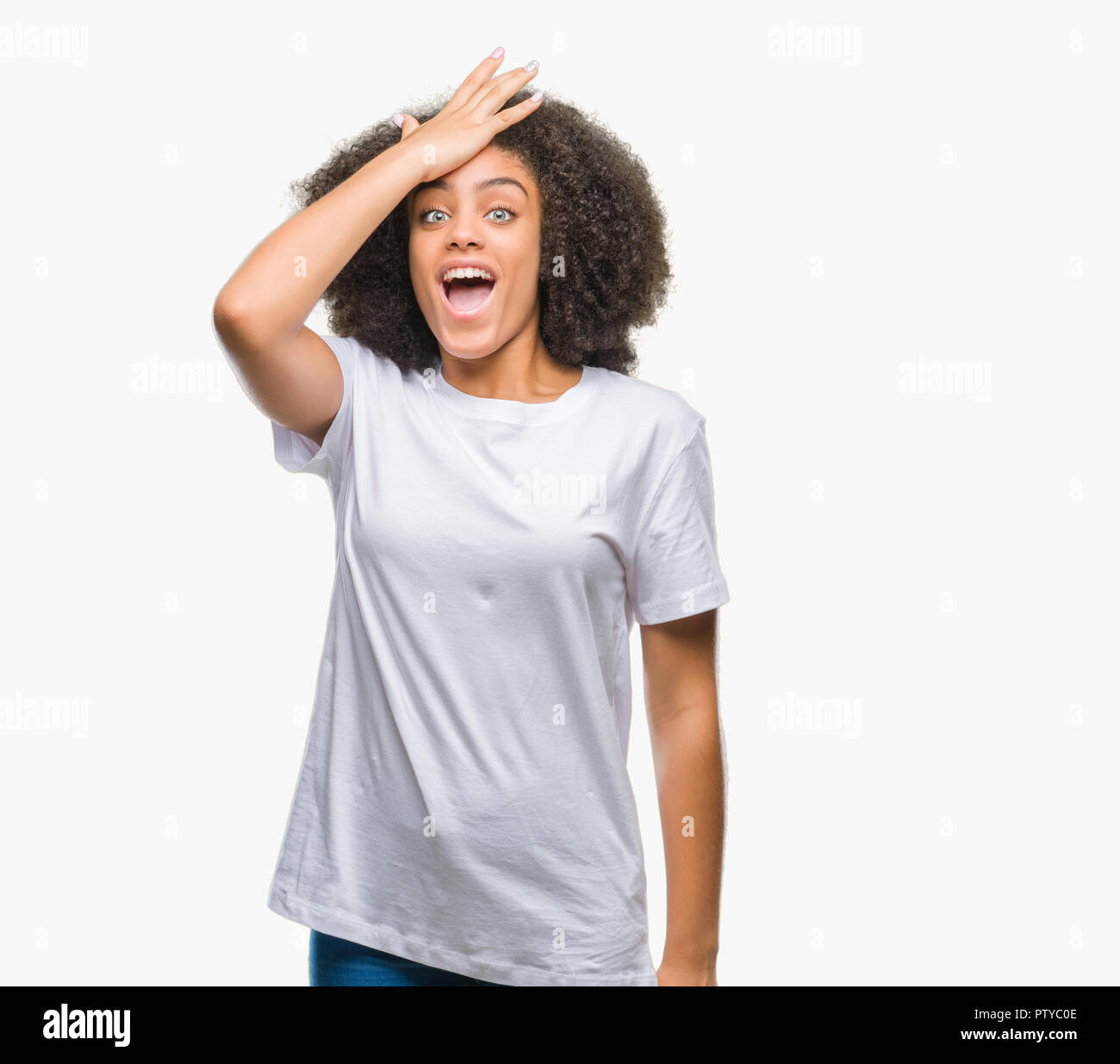 Young afro american woman over isolated background surprised with hand ...