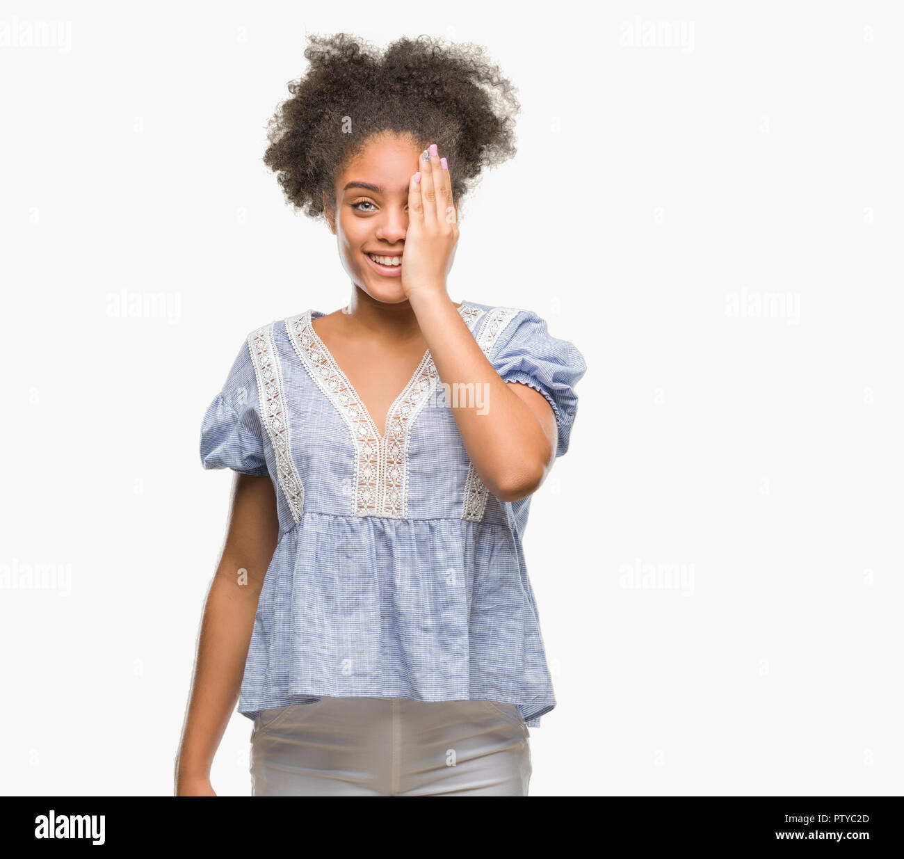 Young afro american woman over isolated background covering one eye ...