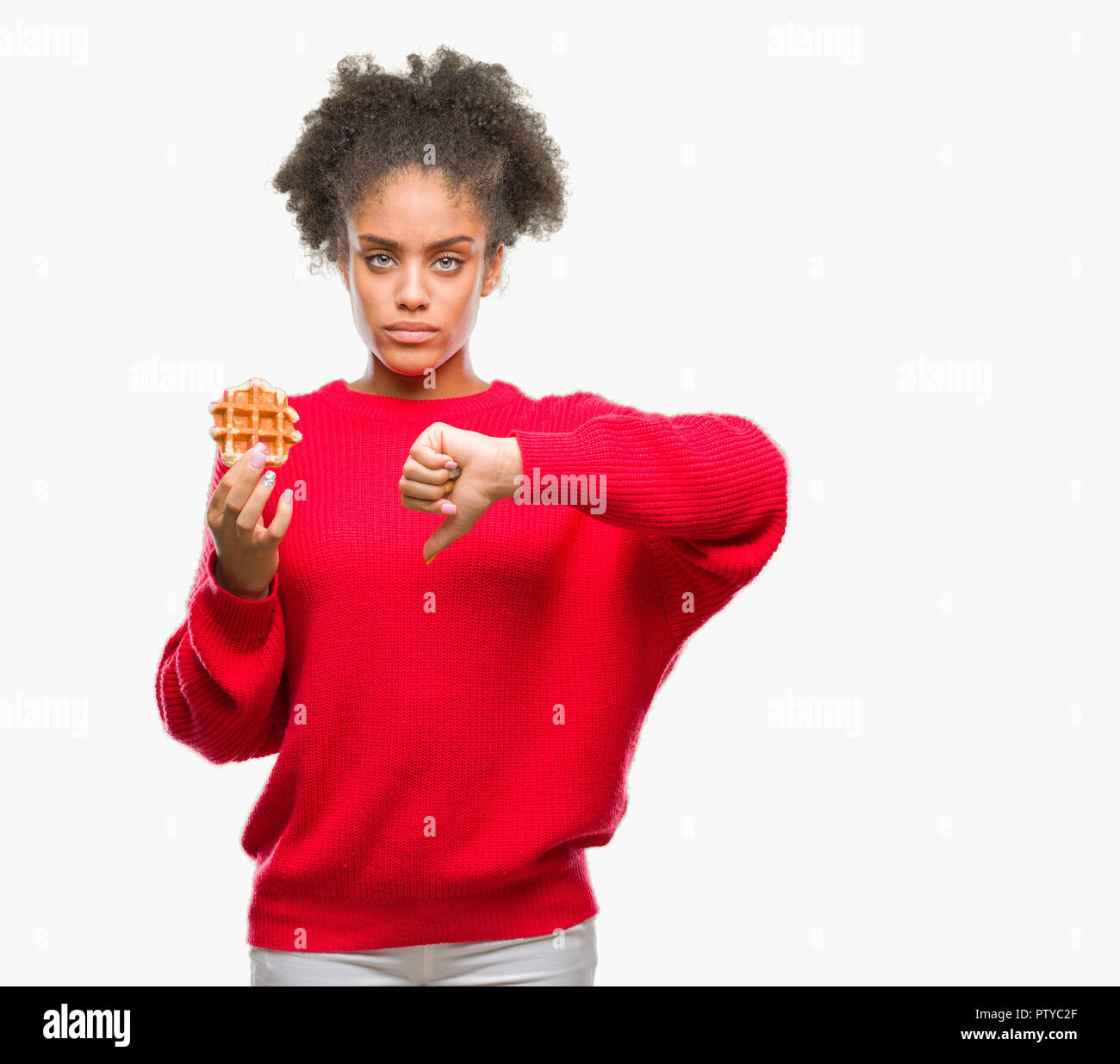 Young beautiful afro american woman eating waffle over isolated ...