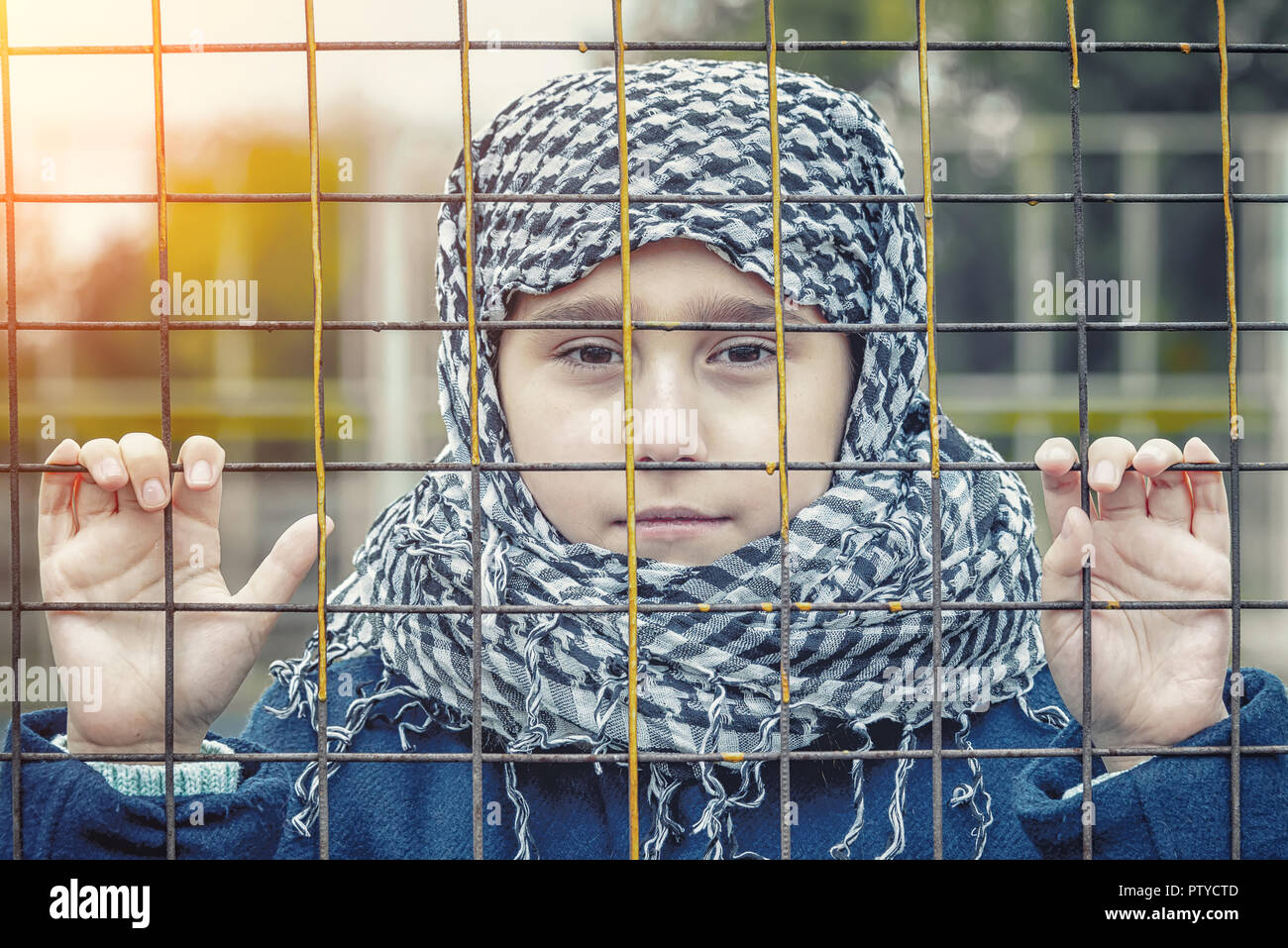 crying refugee girl from the east in a headscarf Stock Photo - Alamy