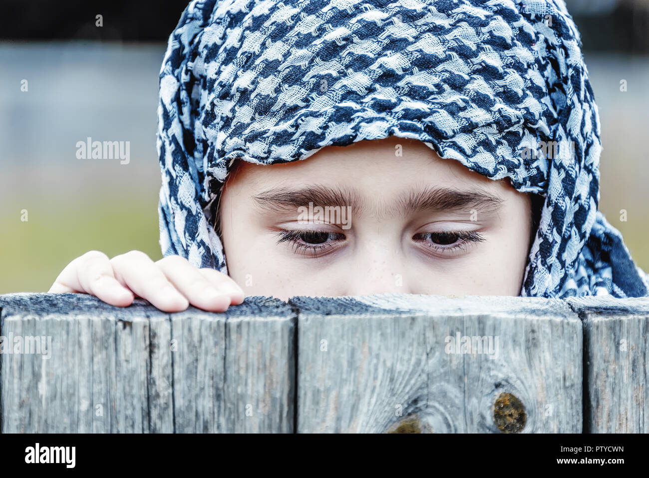 crying refugee girl from the east in a headscarf Stock Photo - Alamy