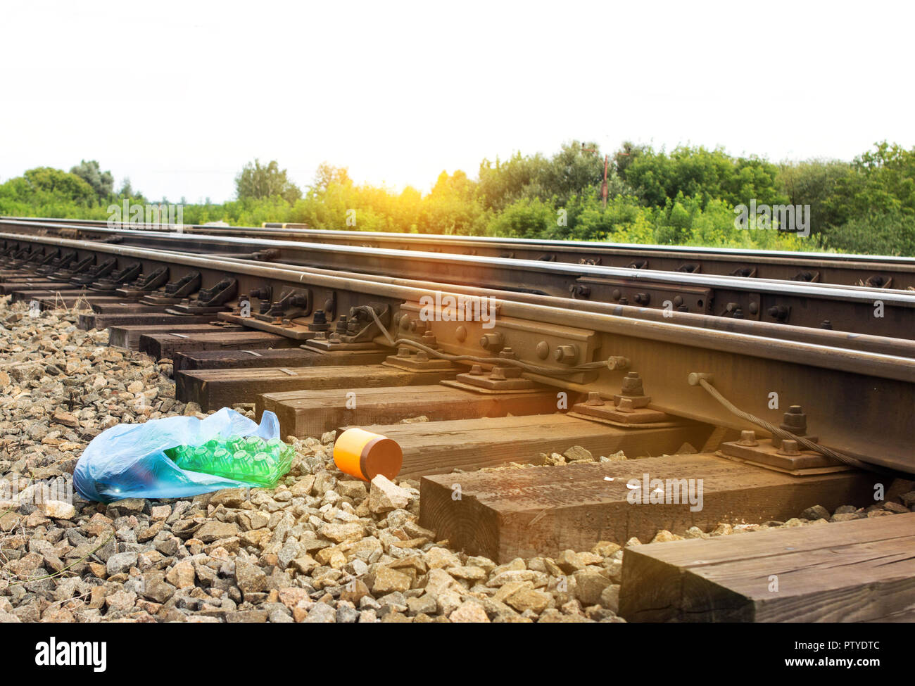 A package with garbage on the railway thrown out from the window of the ...