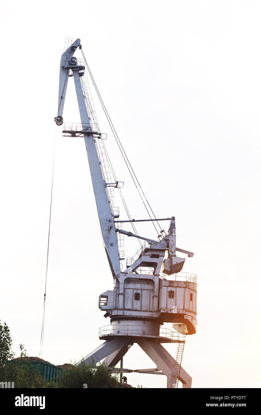 Large port crane with bucket for loading, unloading Stock Photo - Alamy