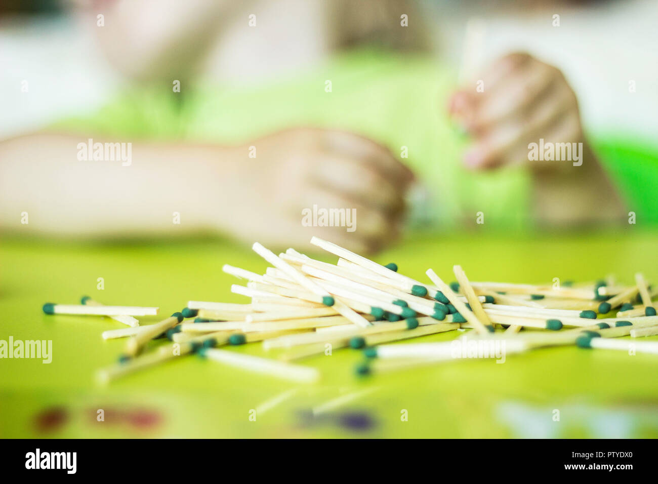 Little baby girl playing with matches, baby and matches, fire, lucifer ...