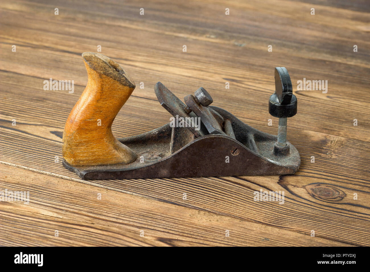 A small jointer for processing a tree, close-up, wooden background ...