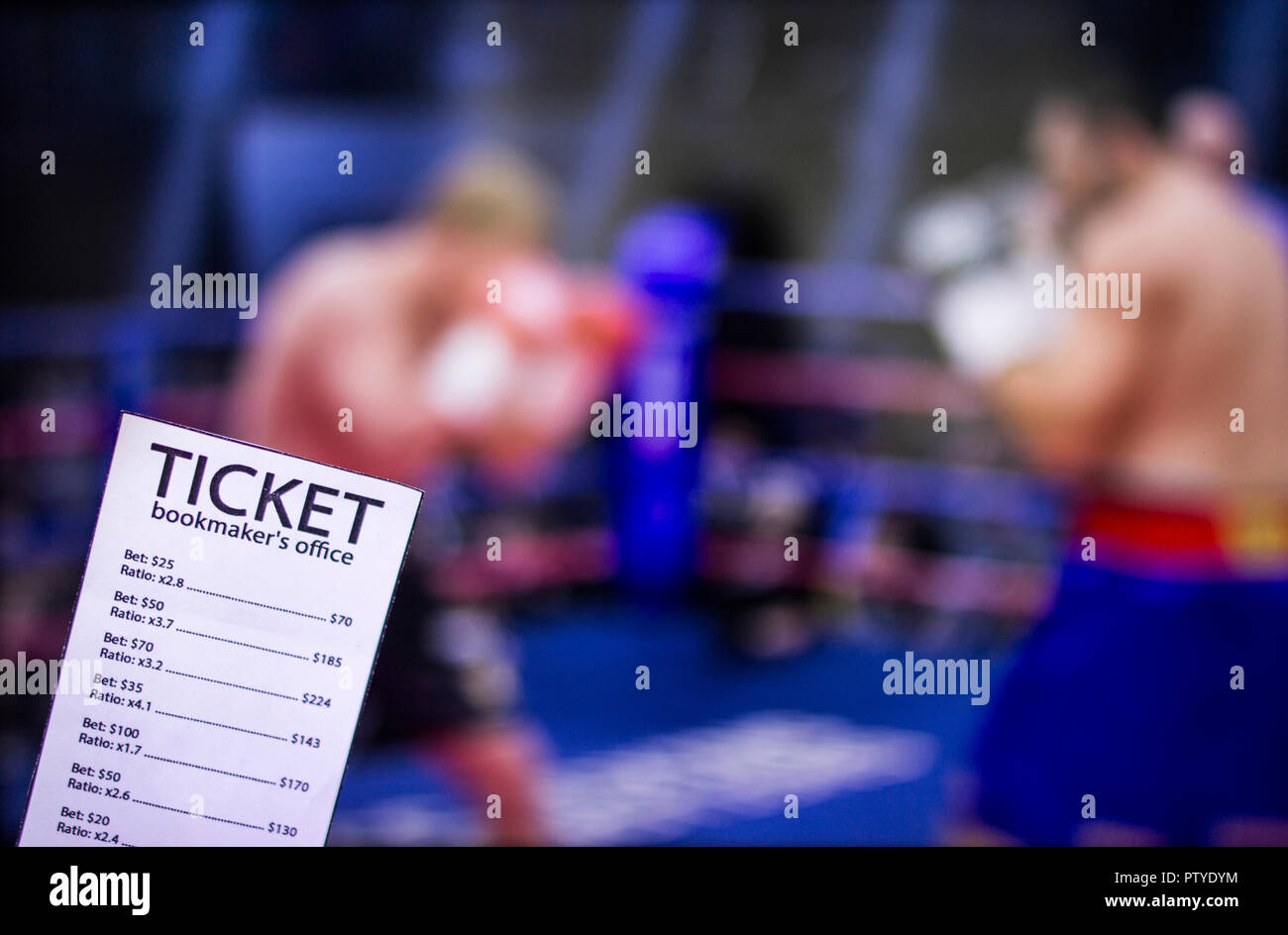Bookmaker ticket on the background of the TV on which show boxing ...
