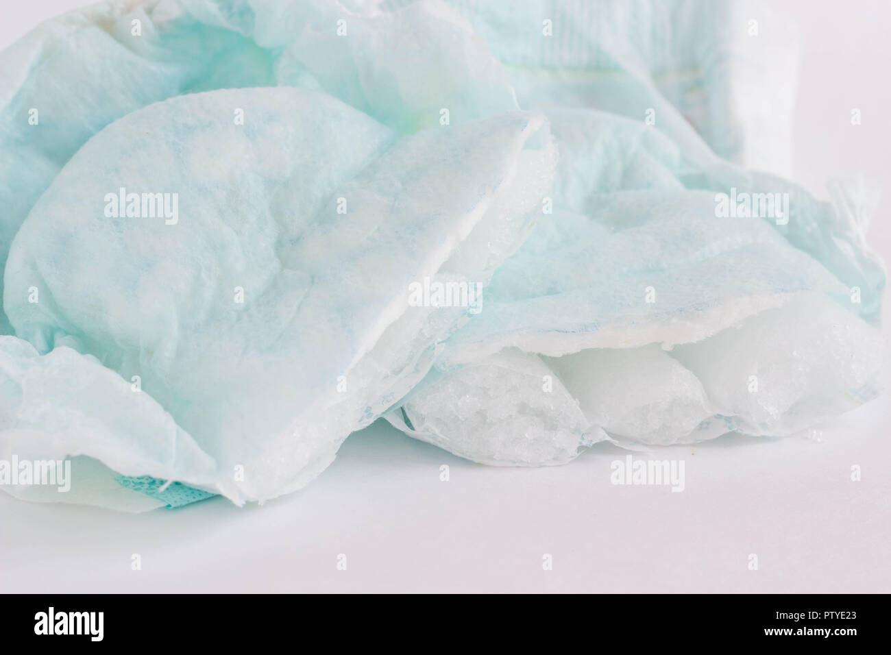 Baby diaper cut in half on white background, close-up Stock Photo - Alamy