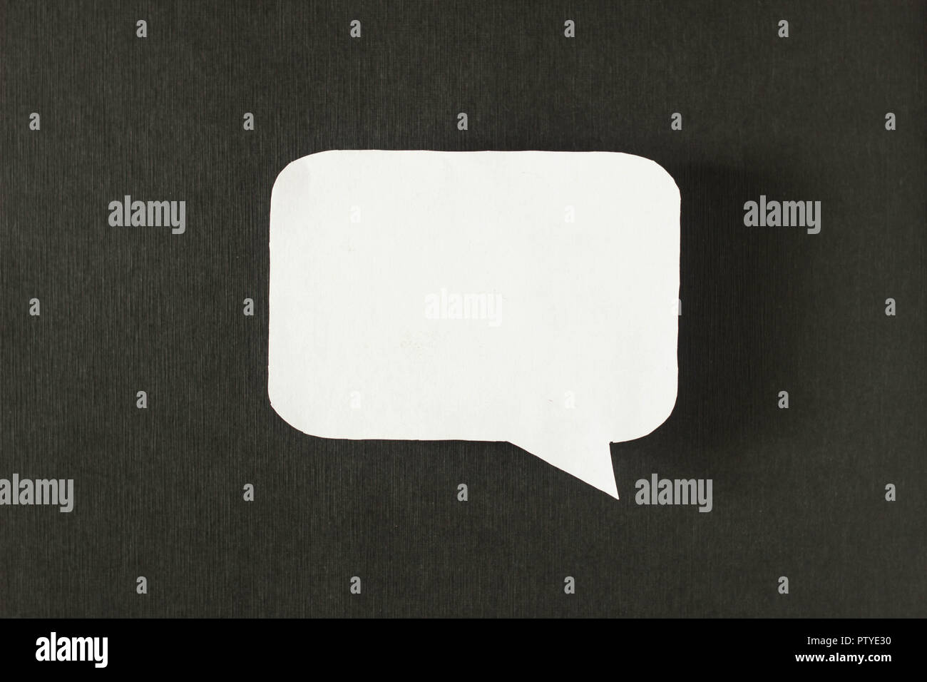 Symbol sign message from a white paper on a black background, social ...