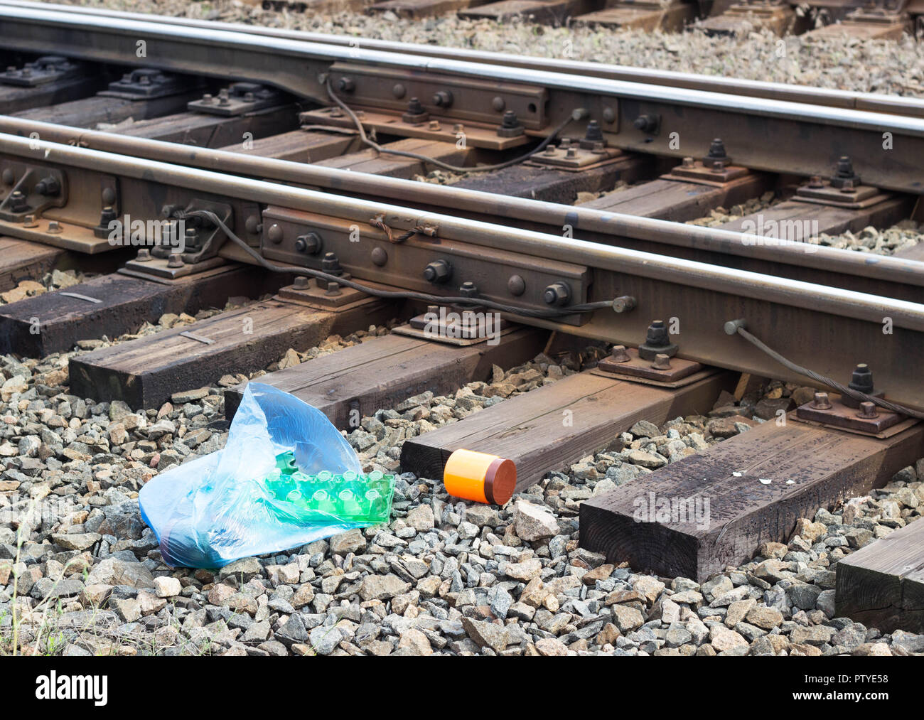 A package with garbage on the railway thrown out from the window of the ...