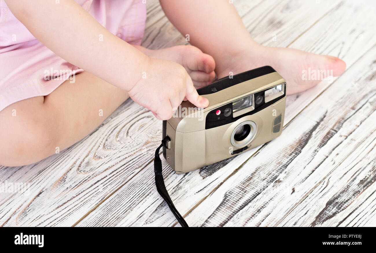 Little girl playing with camera, close-up Stock Photo - Alamy