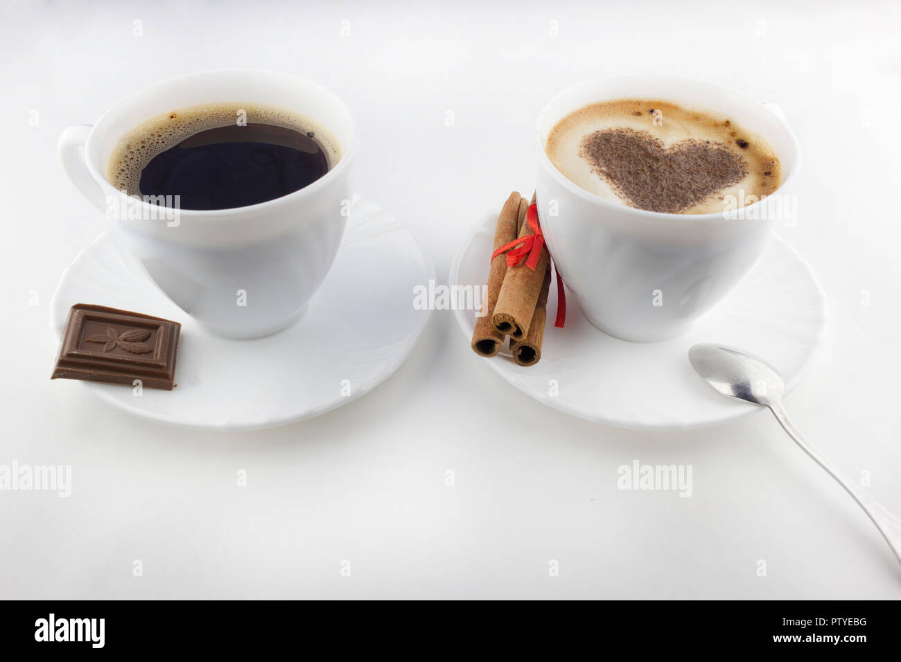 Two cups of coffee on a white background, cinnamon, chocolate Stock ...
