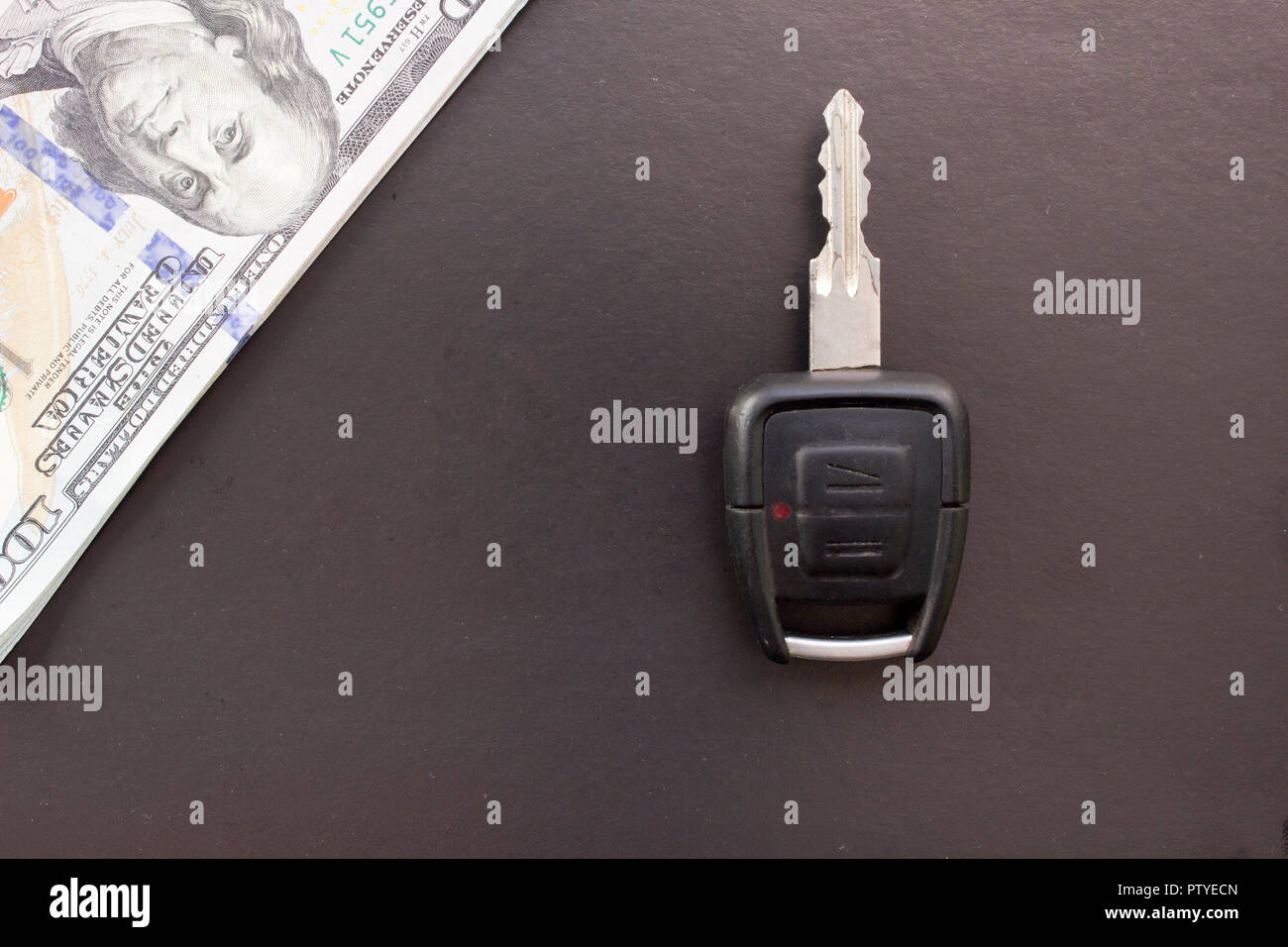 Car key and dollars, black background, purchase Stock Photo - Alamy