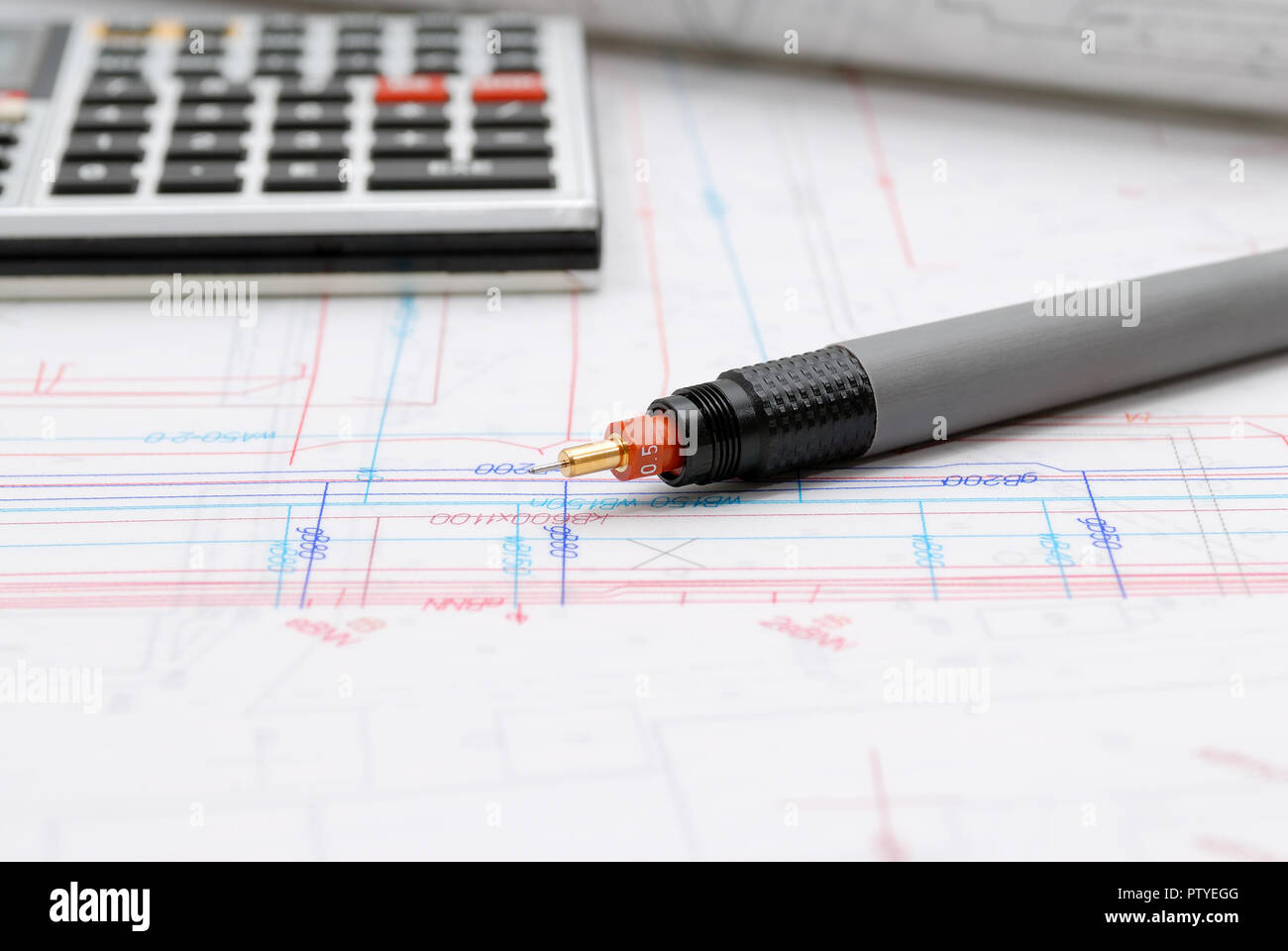 Architectural plans, calculator and drawing utensils Stock Photo - Alamy