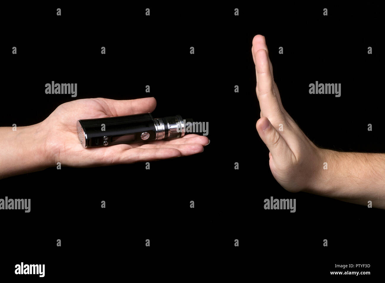 female hand holding an electronic cigarette offering a man but he ...