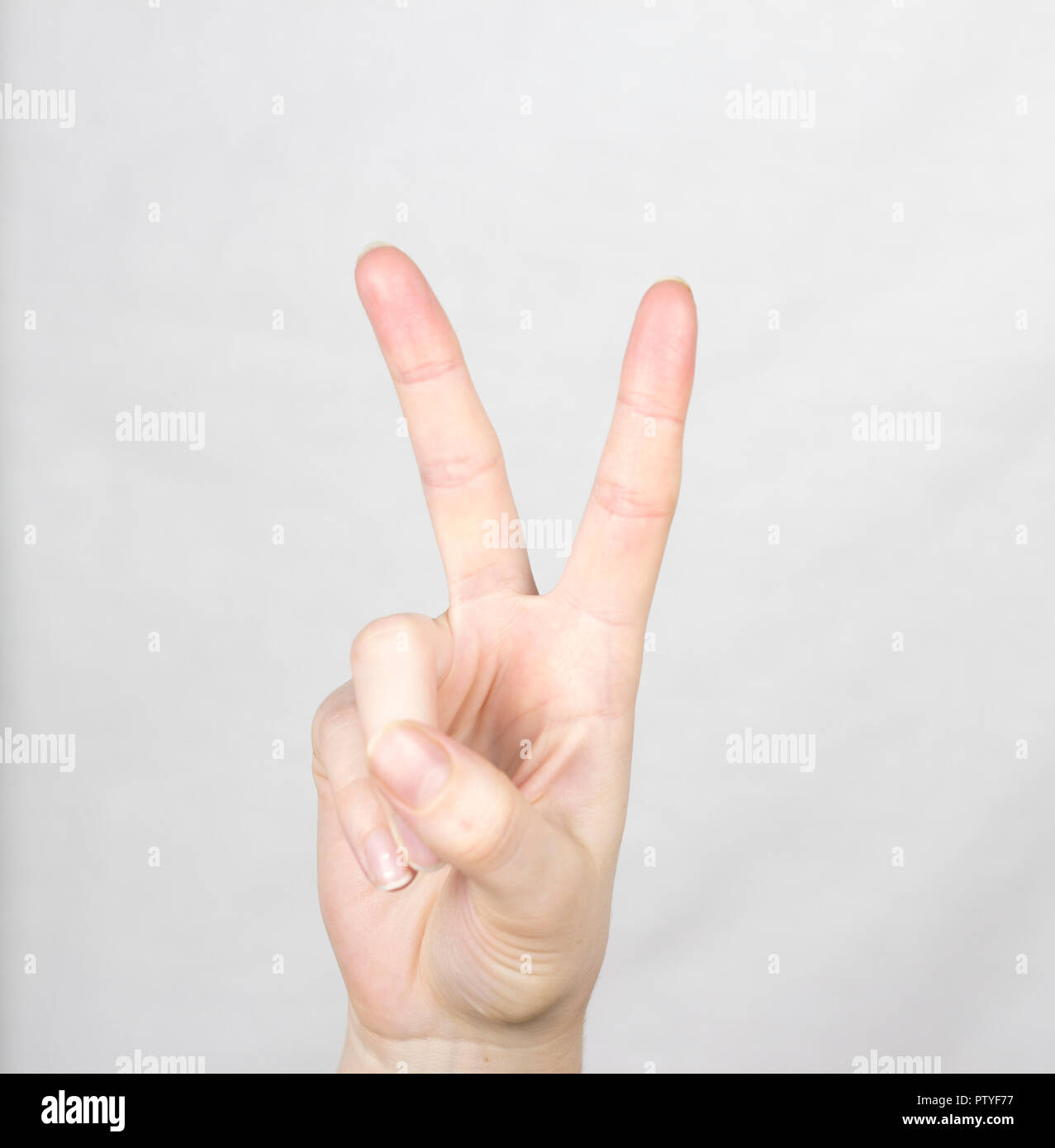 Female hand gesture is all good on a white background Stock Photo - Alamy