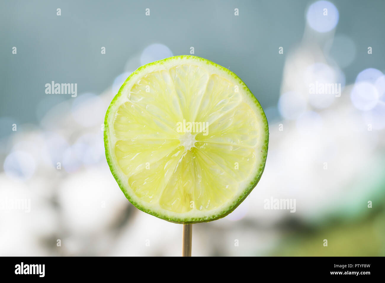 Fruit lime slices over shine background. Citrus fruit Stock Photo - Alamy
