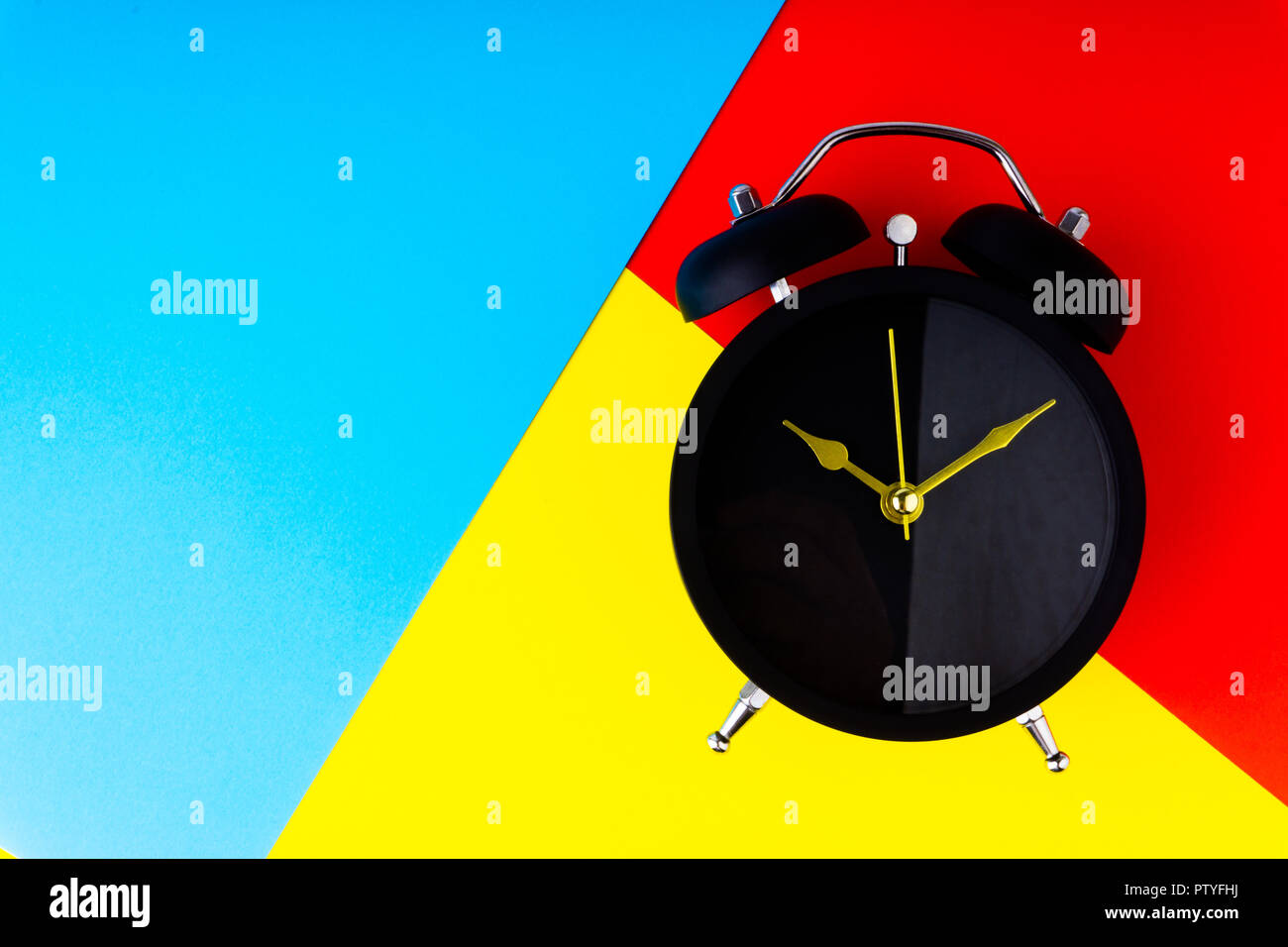 Clock on colorful background with selective focus and crop fragment ...