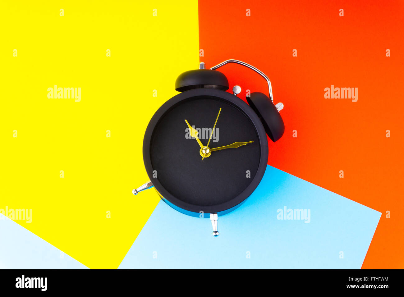 Clock on colorful background with selective focus and crop fragment ...