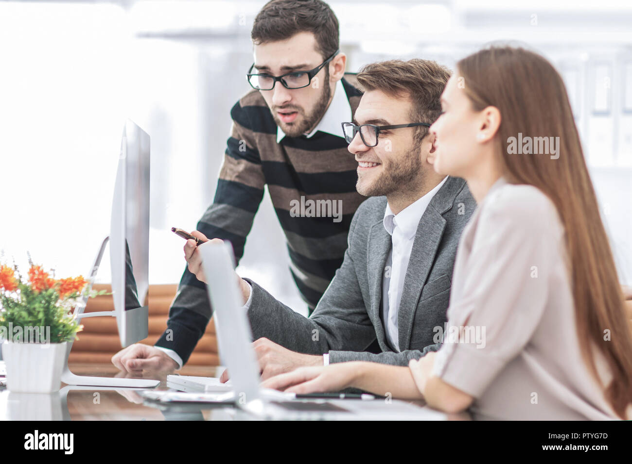 professional business team is developing a new project ,sitting behind ...