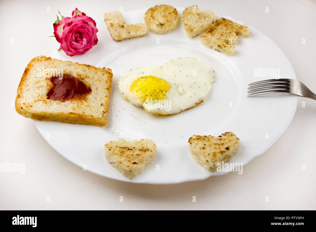 Scrambled eggs with love on white background, roses Stock Photo - Alamy