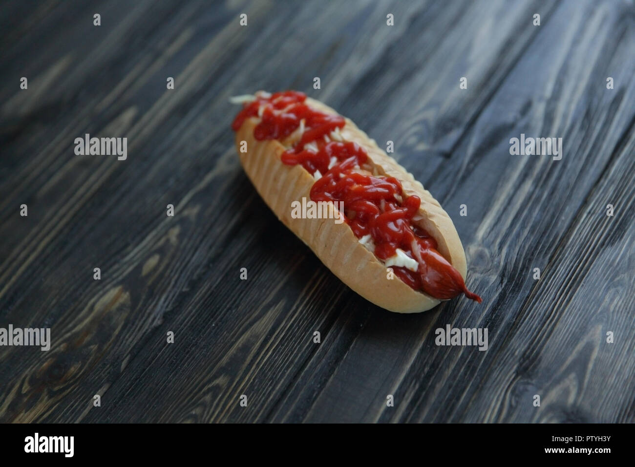 hot dog with spicy sauce on dark background.photo with copy spac Stock ...