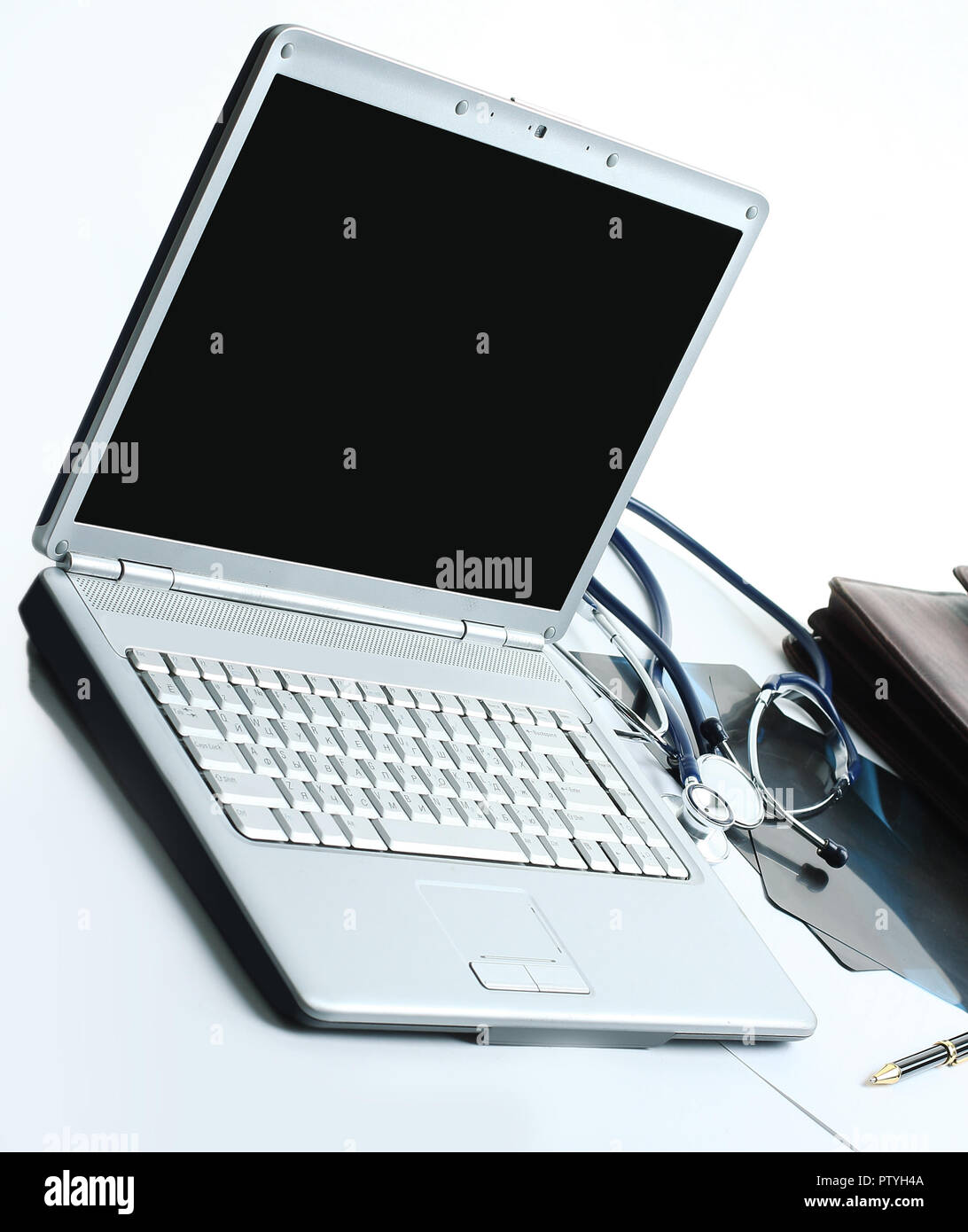 closeup. laptop and stethoscope in the workplace therapist Stock Photo ...
